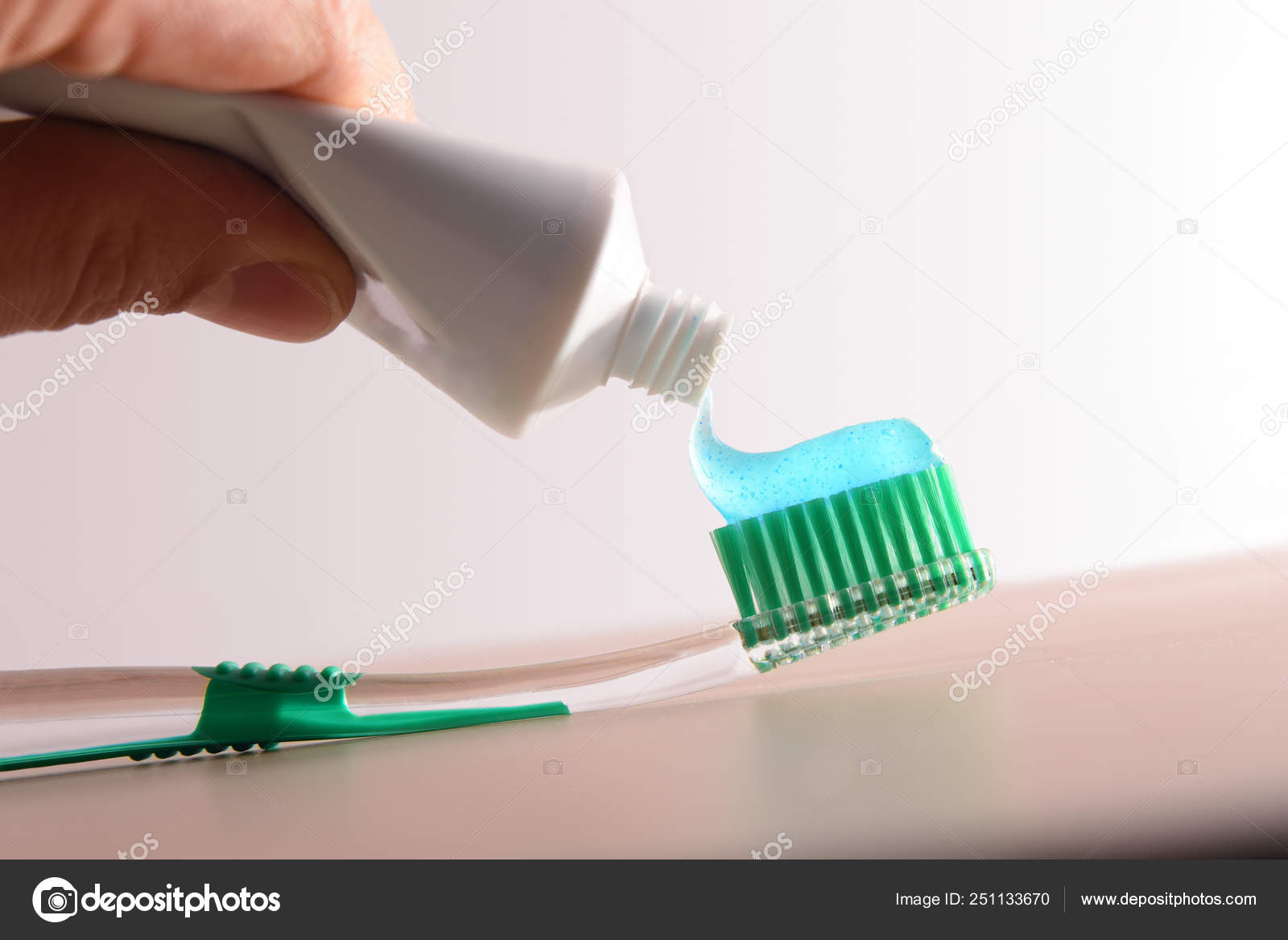 Putting Toothpaste On Toothbrush