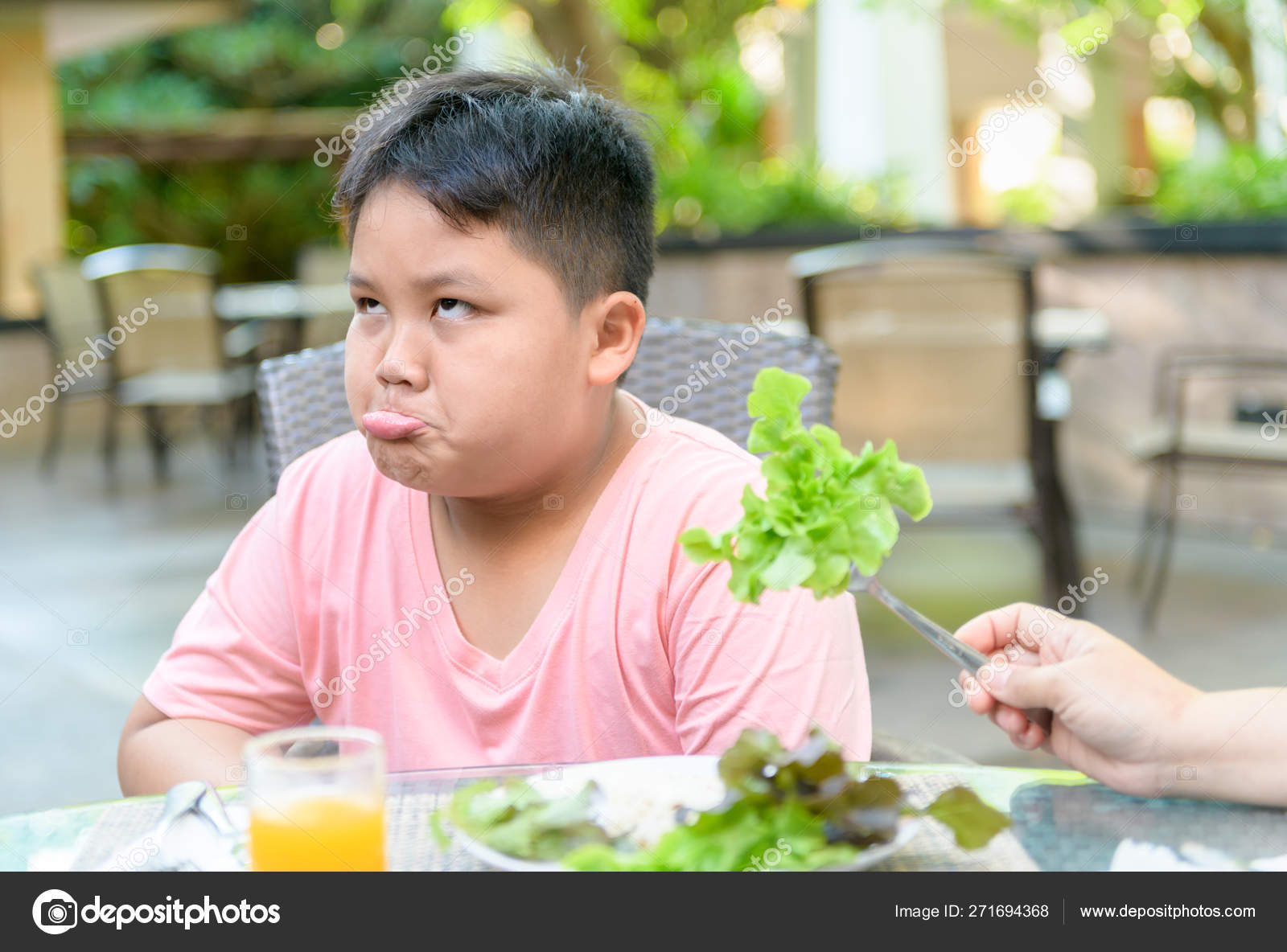 Boy with expression of disgust against vegetables Stock Photo by ...
