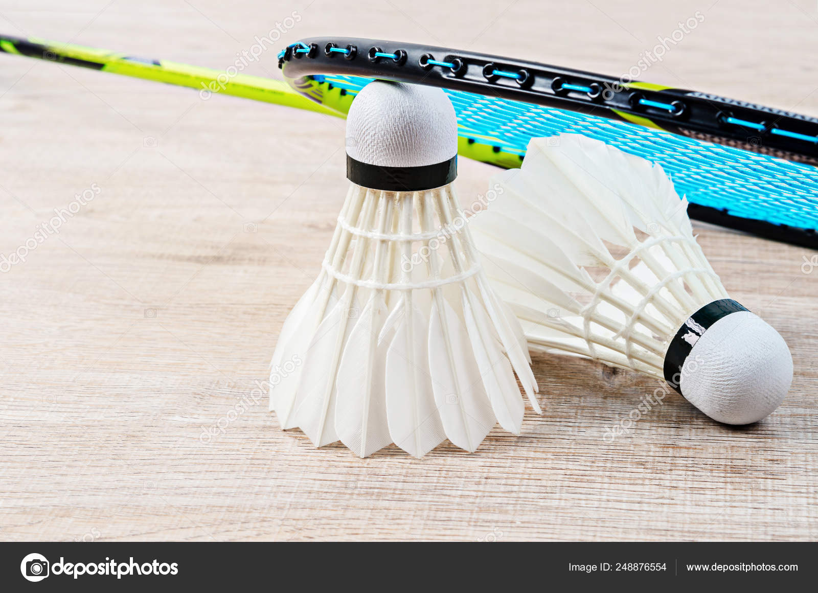 Close up shuttlecock and badminton racket. Stock Photo by ©gamjai 248876554