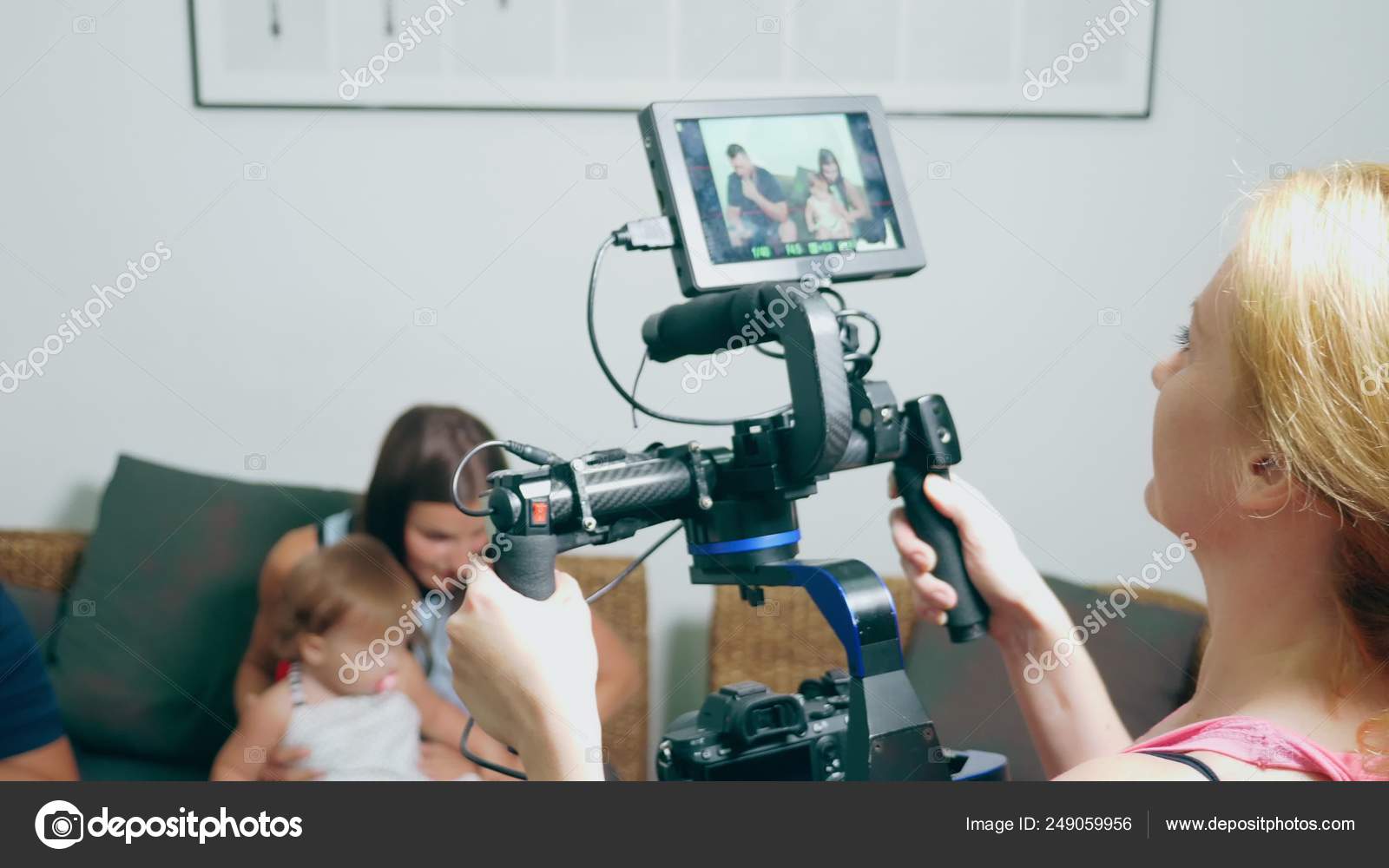 Video shooting process. An operator with a steadicam shoots a story ...