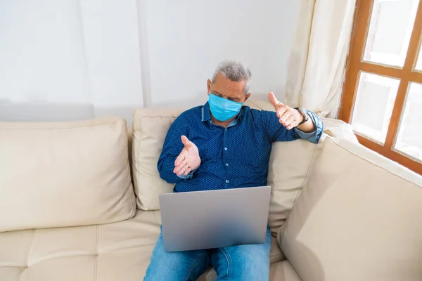 COVID-19 Online medical consultation. Sick man with mask connecting to ...