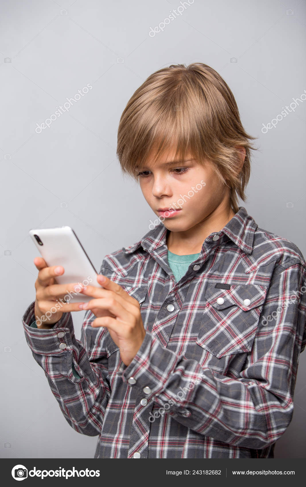 Cute Teenage Boy Using Cellphone Isolated Grey Background Focus Phone ...