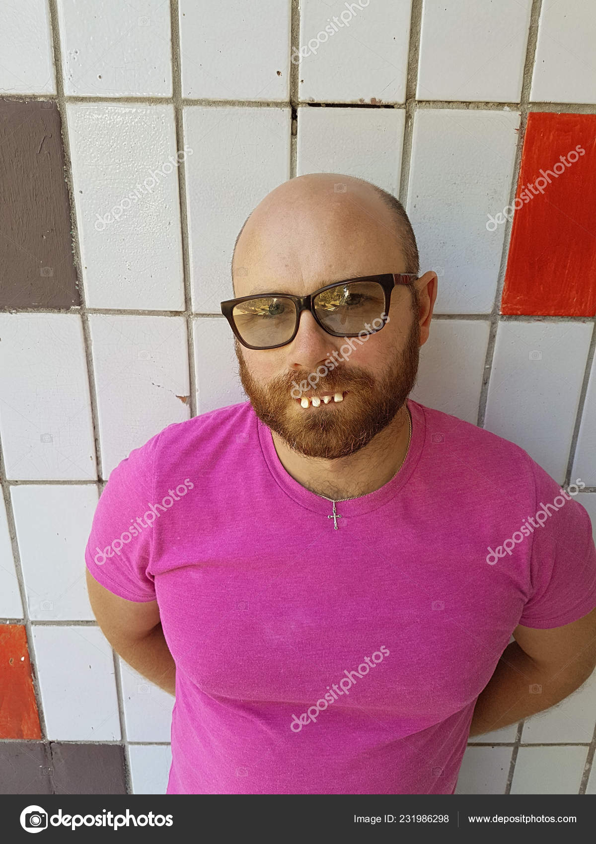 Bald man in eyeglasses with ugly teeth Stock Photo by ©sarymsakov 231986298