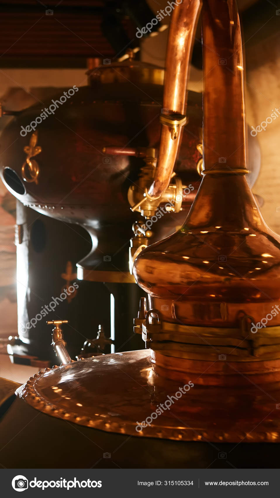 Medieval traditional distiller, cube made from copper production of ...