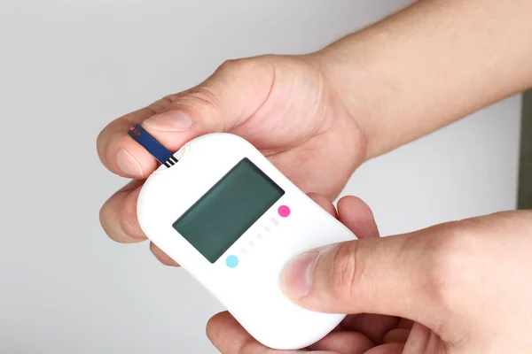 Fingerstick glucose meter Stock Photos, Royalty Free Fingerstick ...