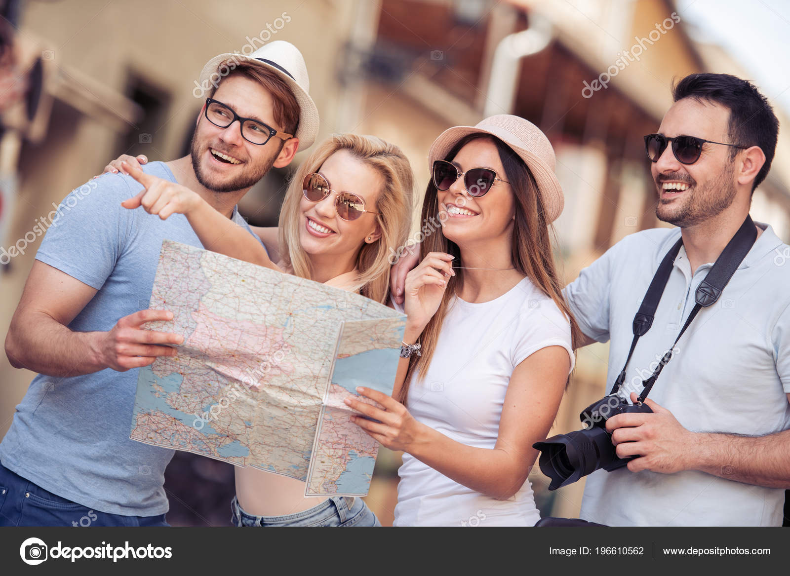 Young Friends Using Map Determine Direction Walking Stock Photo by ...