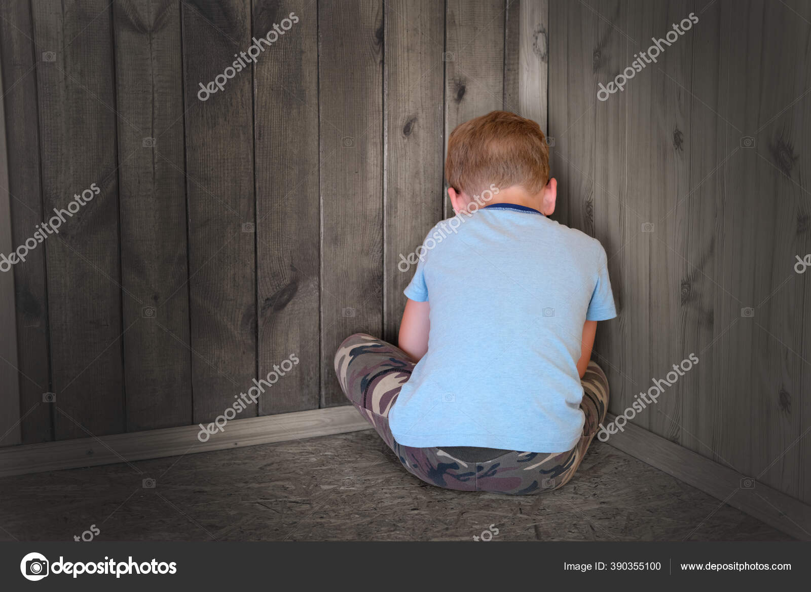 Sad little boy sitting in the corner turned his back. Stock Photo by ...