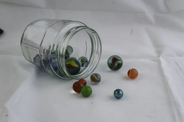 Glass marbles in container Stock Photos, Royalty Free Glass marbles in ...