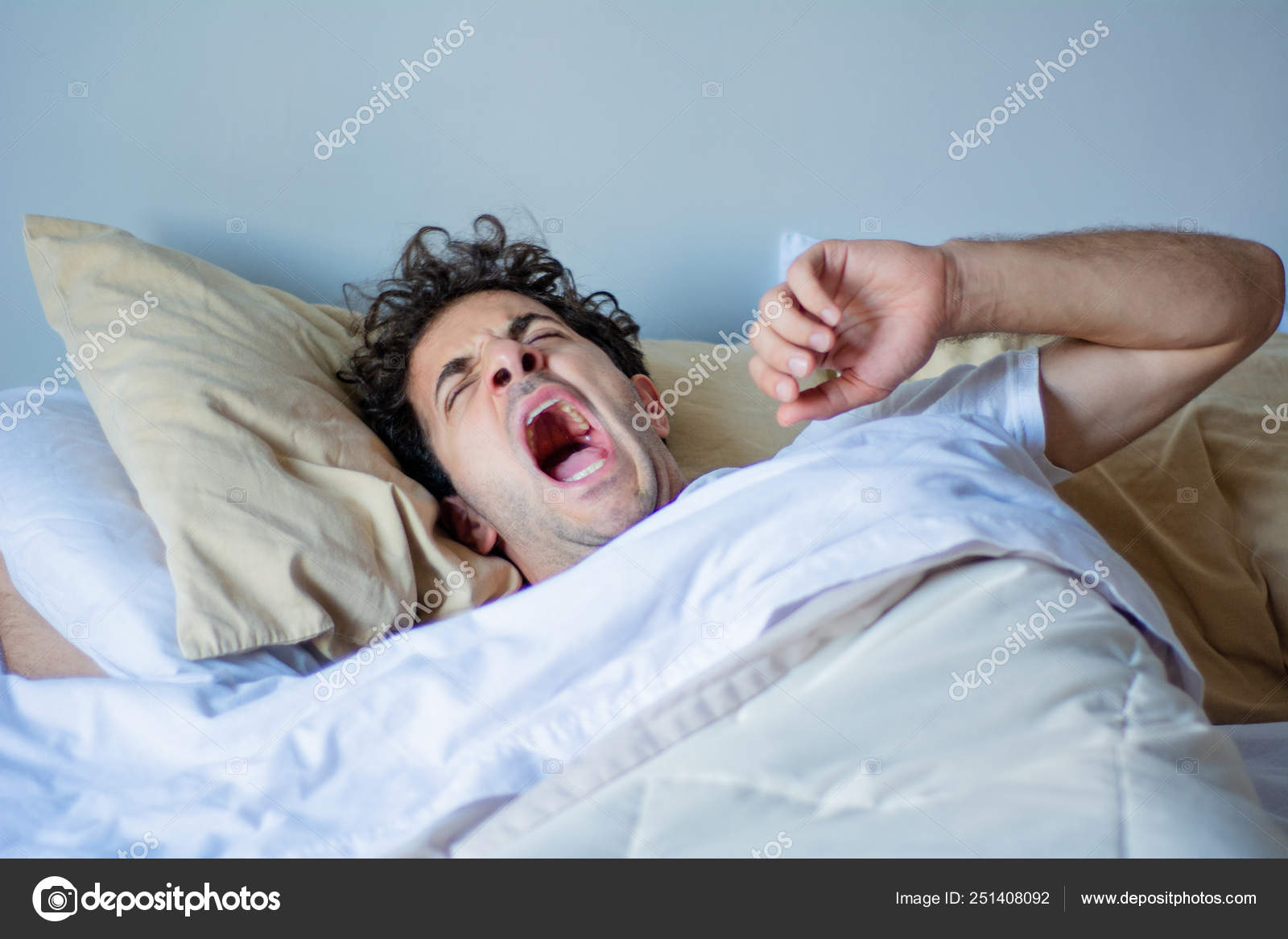 Guy Yawning In Bed