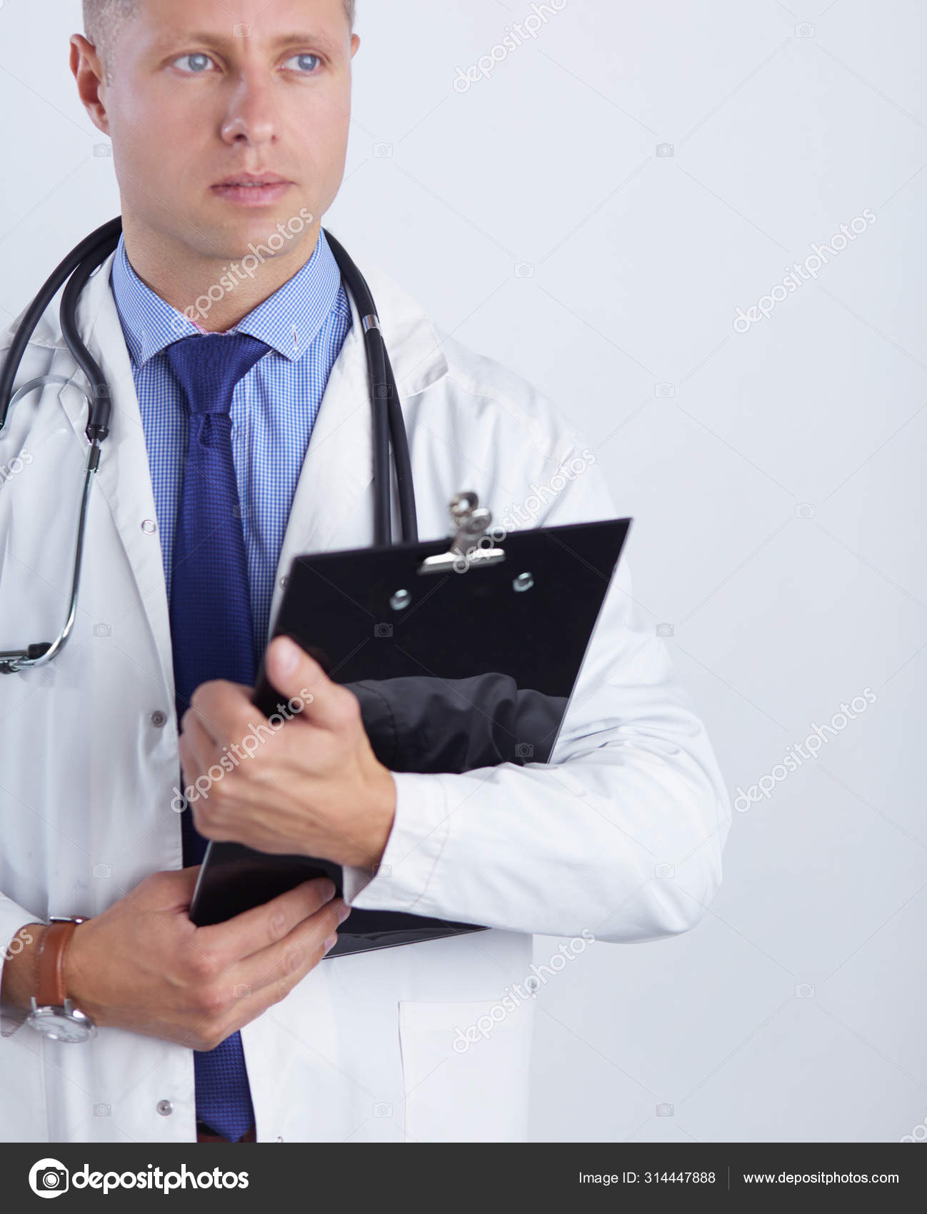 Male doctor standing with folder, isolated on white background Stock ...