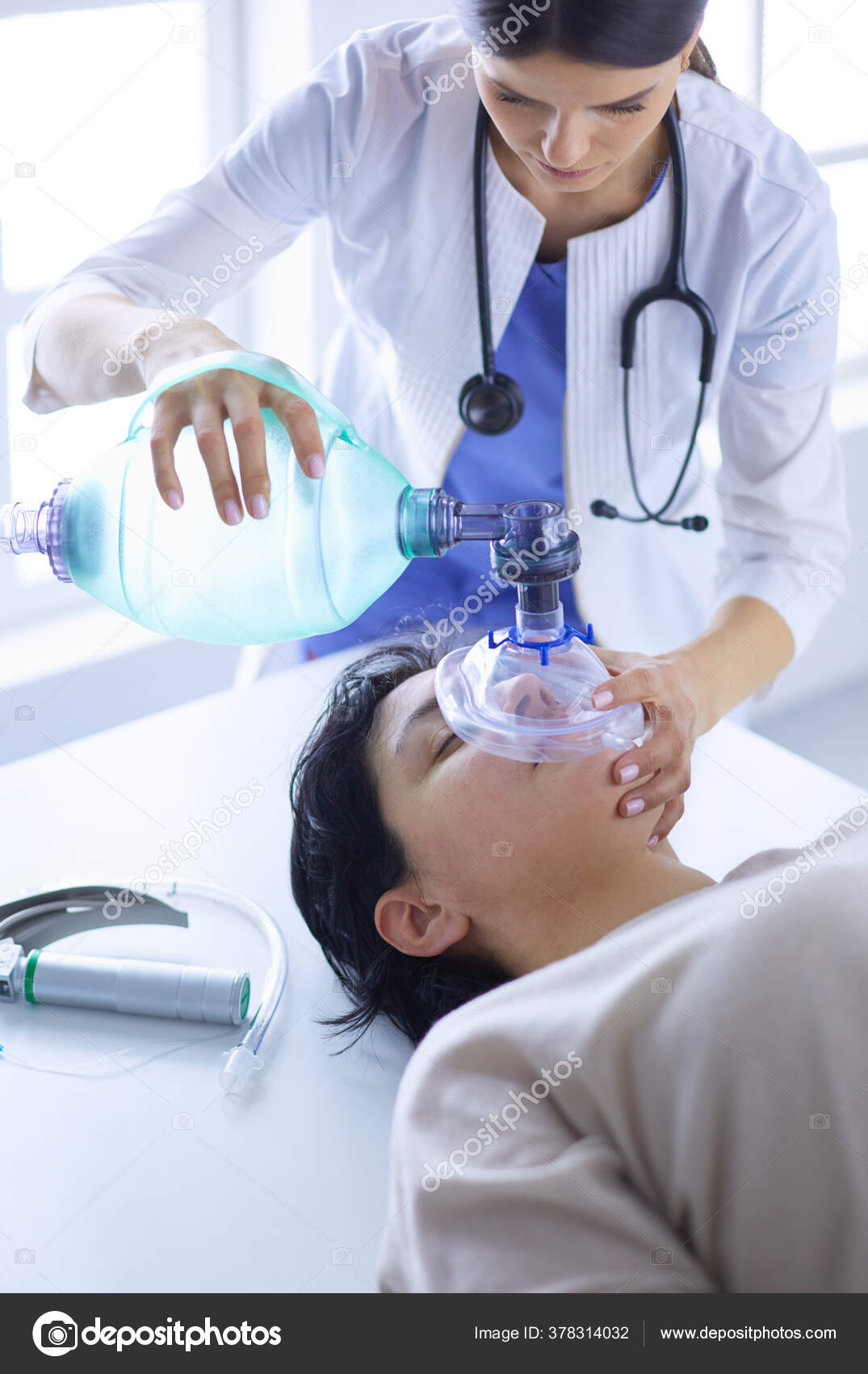 Doctor putting an oxygen mask in the hospital Stock Photo by ©Lenets ...