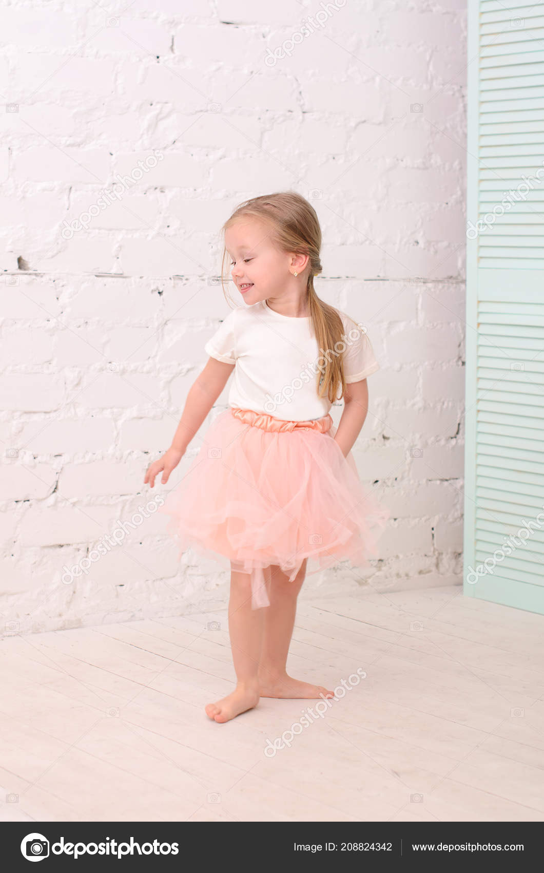 Blonde Girl Dancing Background White Brick Wall Stock Photo by ©Cheese ...