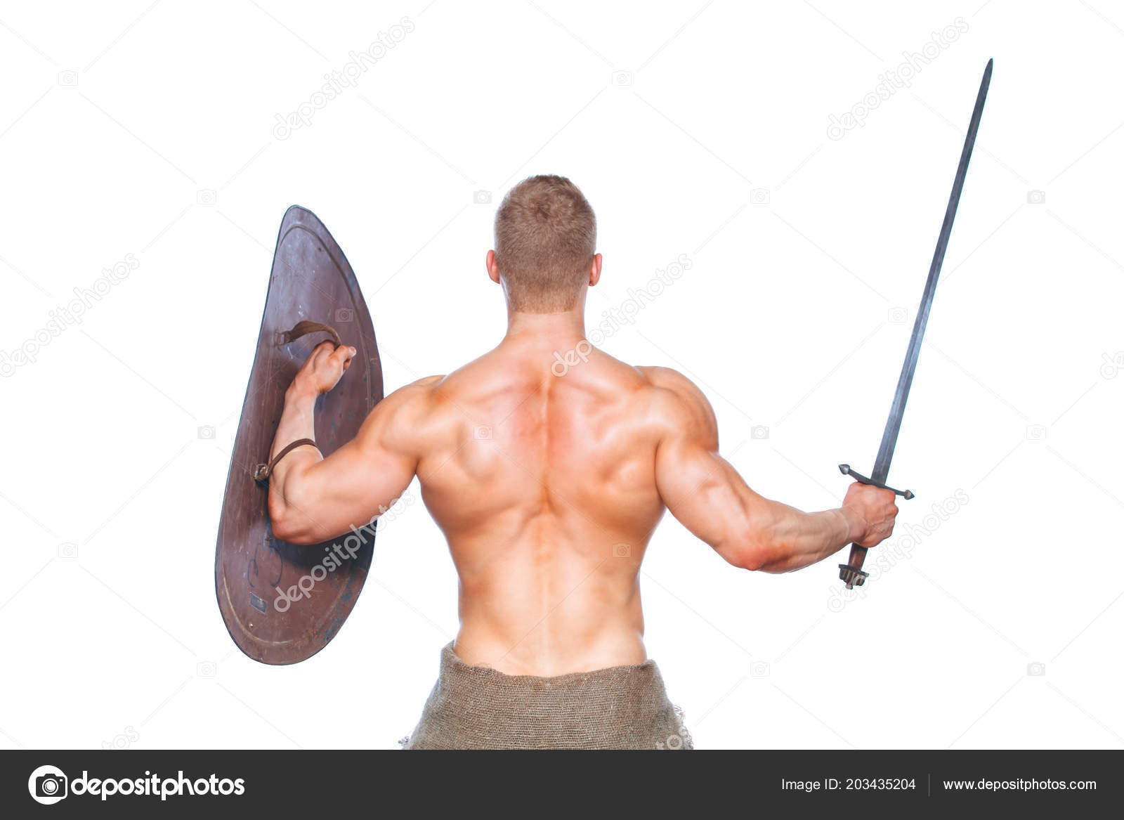 Bodybuilder man posing with a sword and shield isolated on white ...