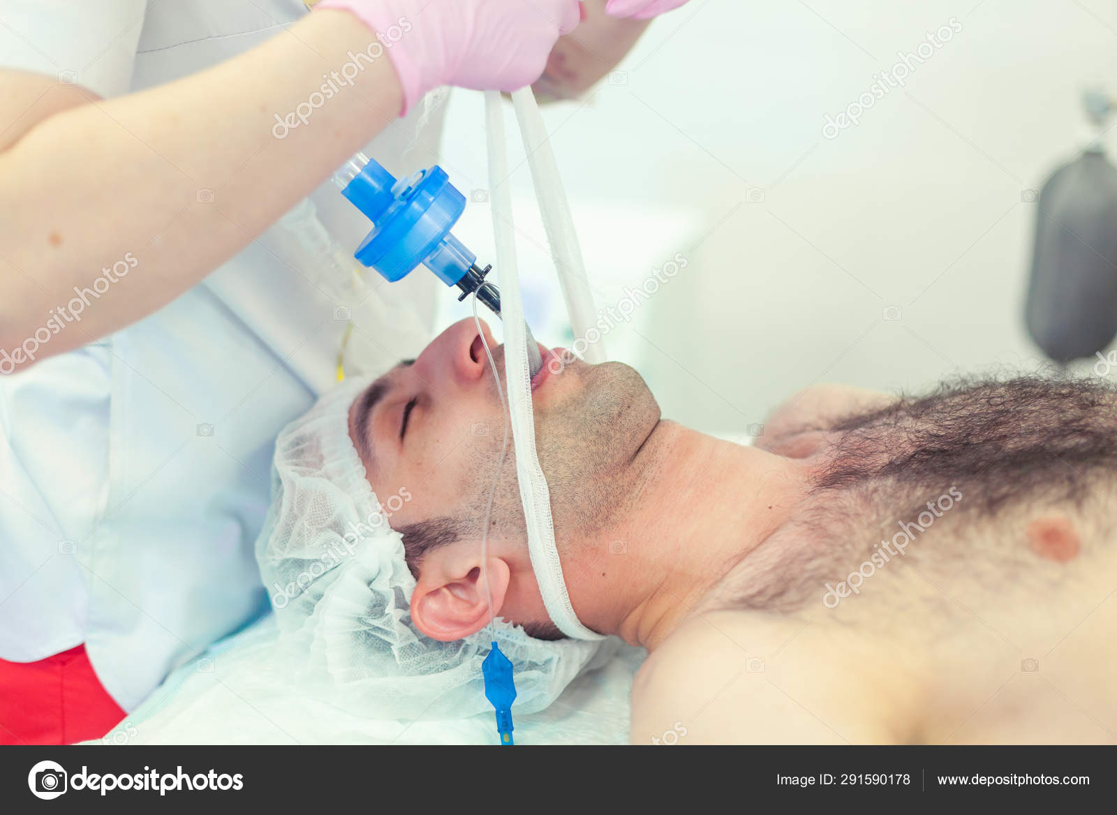 Anesthesiologist performing tracheal intubation in operation room ...