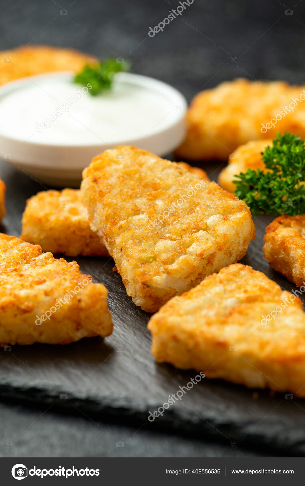 Hash brown potato patties on rustic stone board Stock Photo by ...