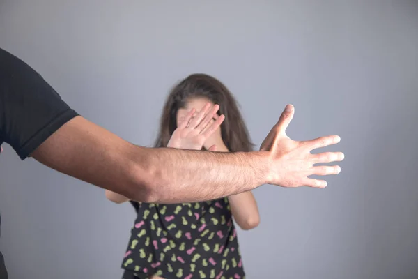 Angry Man Beating Woman Grey Background — Stock Photo © Aghavni #394889038