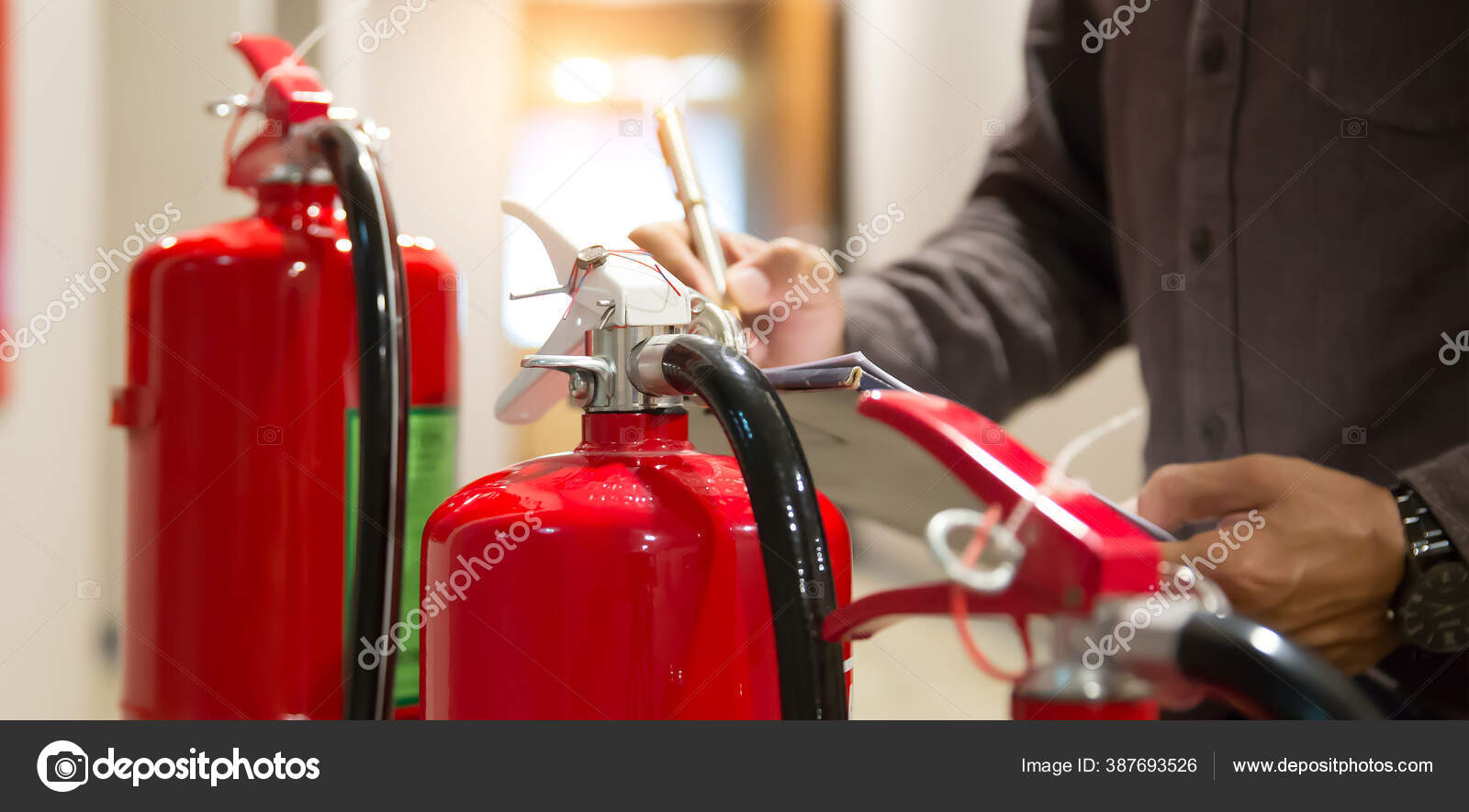 Fire Fighter Checking Fire Extinguishers Tank Building Concepts Fire ...