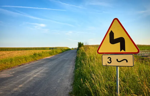 Dangerous bends sign Stock Photos, Royalty Free Dangerous bends sign ...