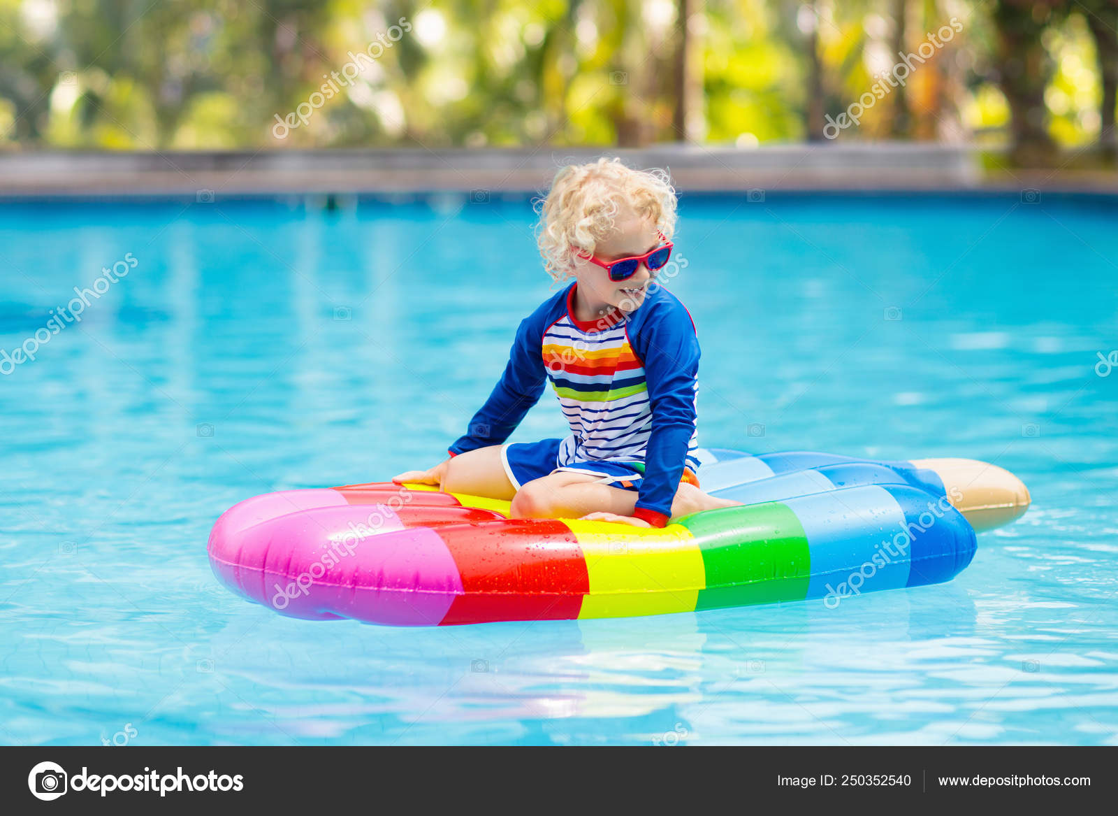Child on inflatable float in swimming pool. Stock Photo by ©FamVeldman ...