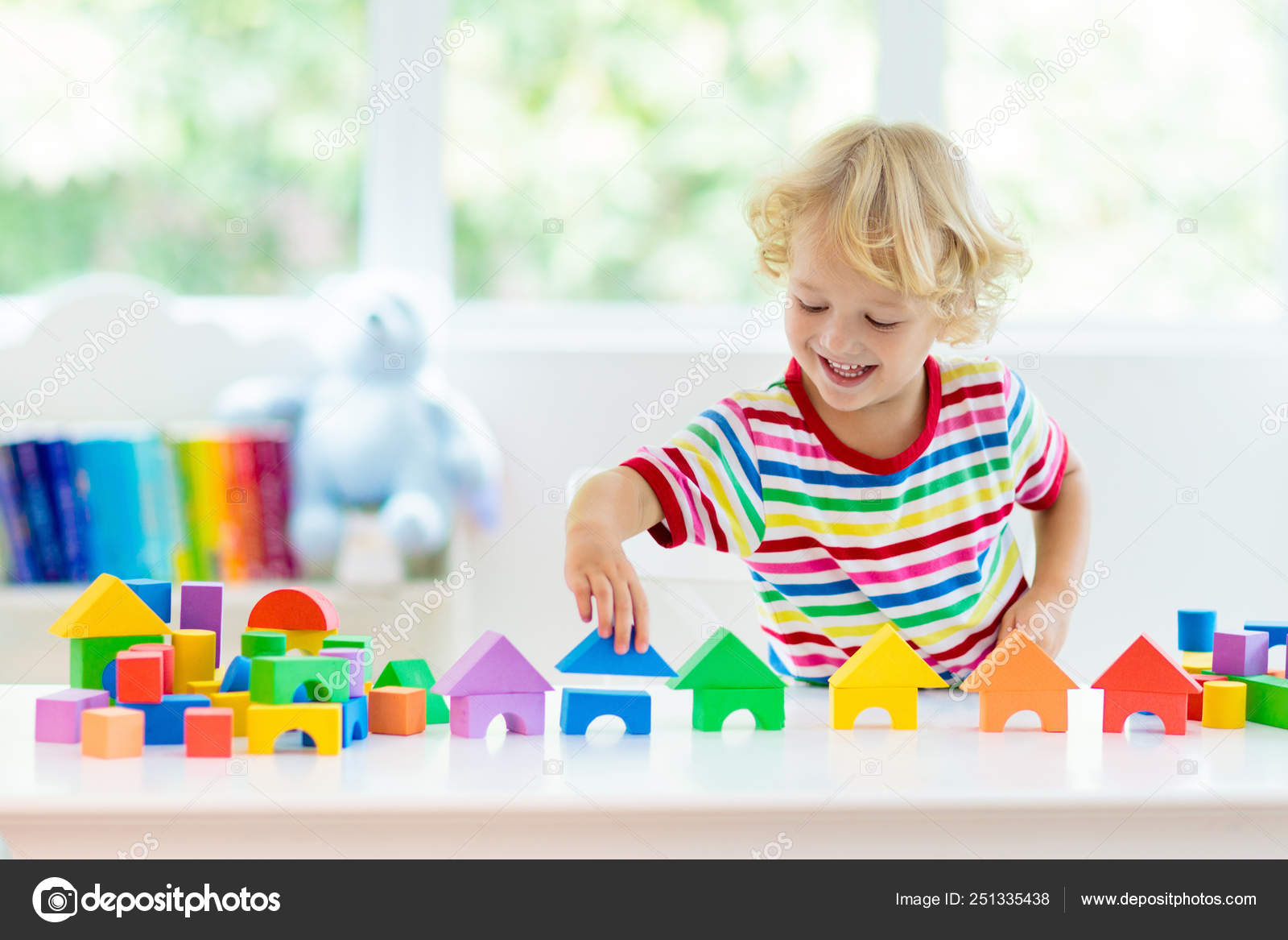 Kids toys. Child building tower of toy blocks. Stock Photo by ...