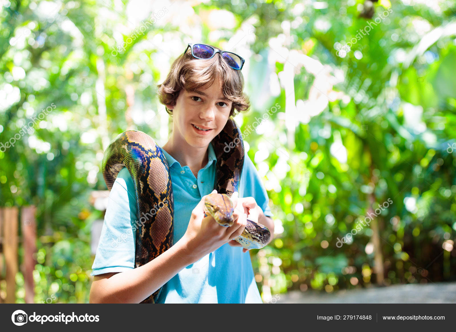 Kids hold python snake at zoo. Child and reptile. — Stock Photo ...