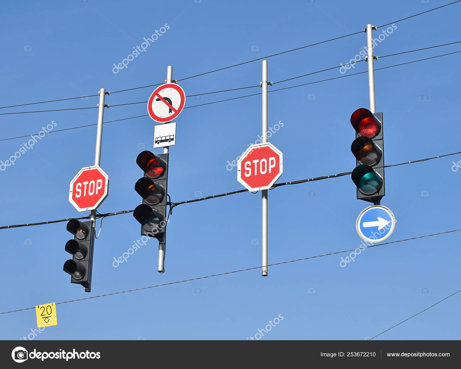 Stop signs and traffic lights at the road crossing Stock Photo by ...