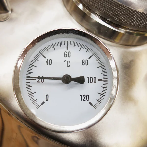 industrial thermometer for high loads, stands on tanks with acid, shows ...