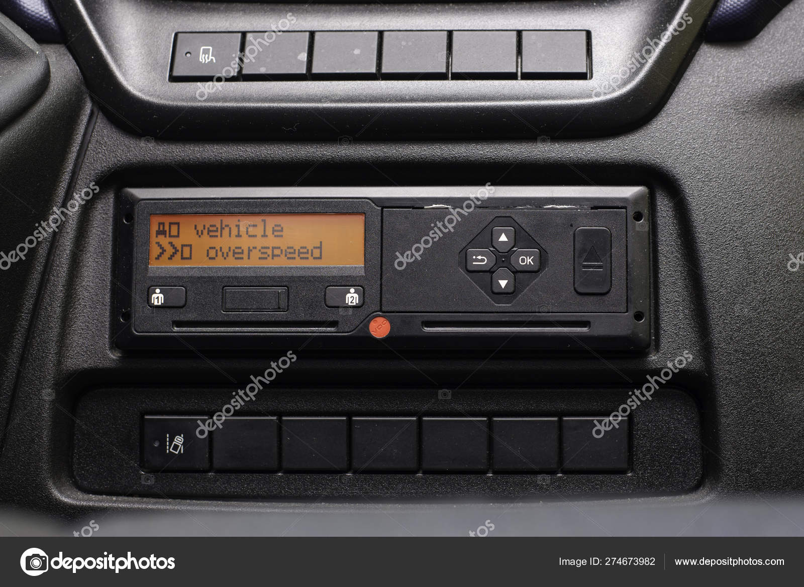 Digital tachograph display reads Vehicle Overspeed. No personal data ...