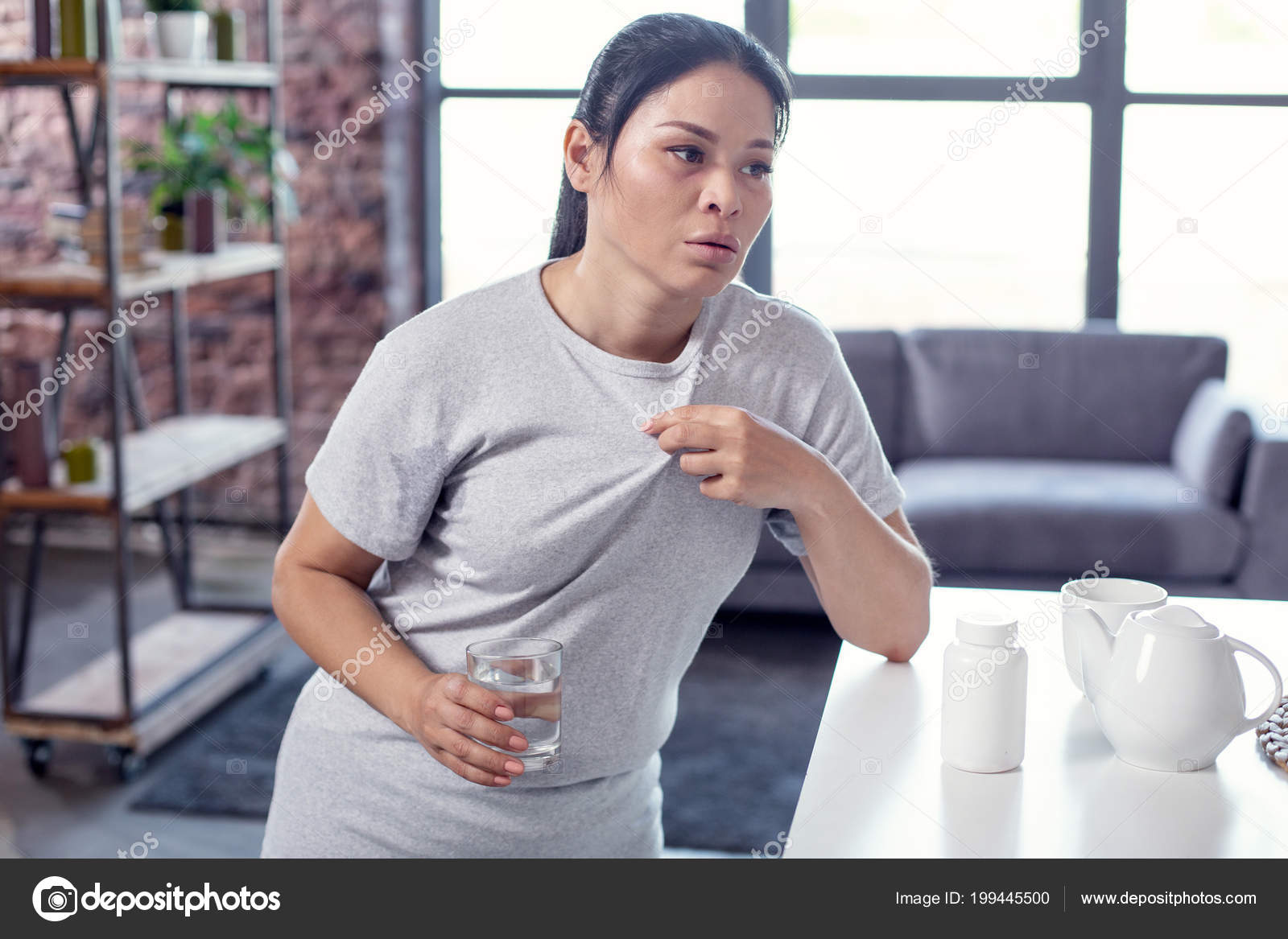 Focused sad woman overcoming flu Stock Photo by ©yacobchuk1 199445500