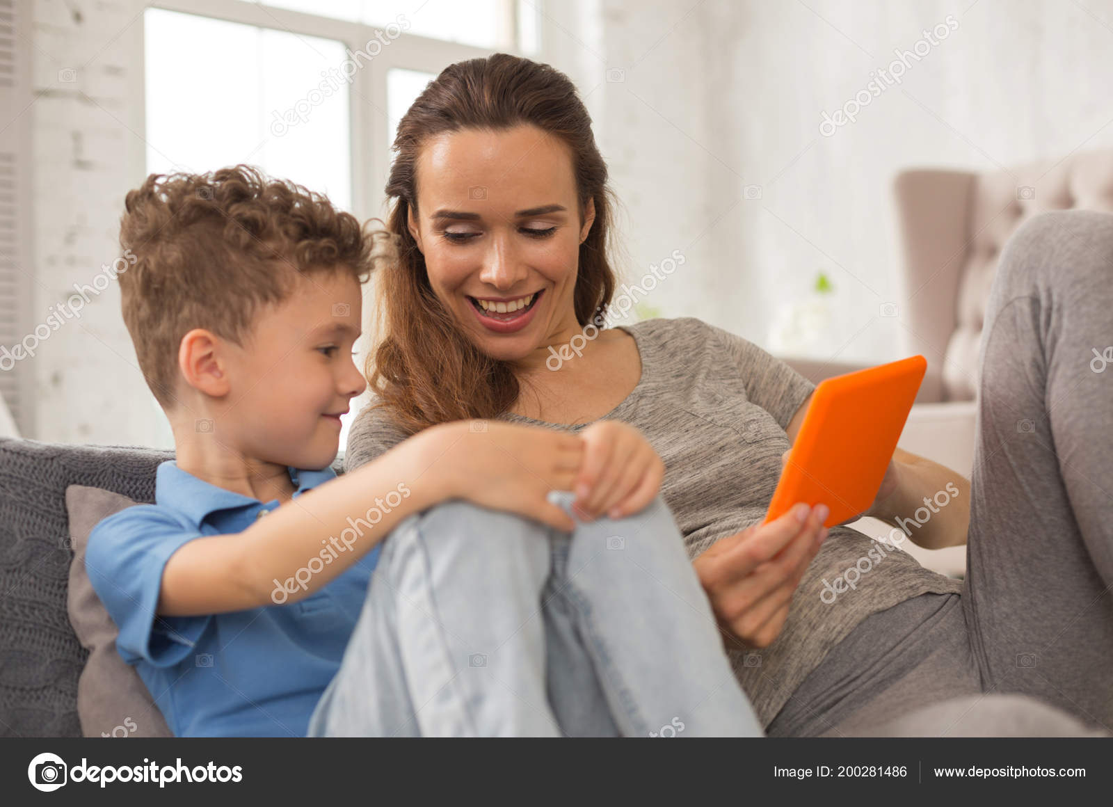 Laughing mother smiling broadly while telling jokes — Stock Photo ...