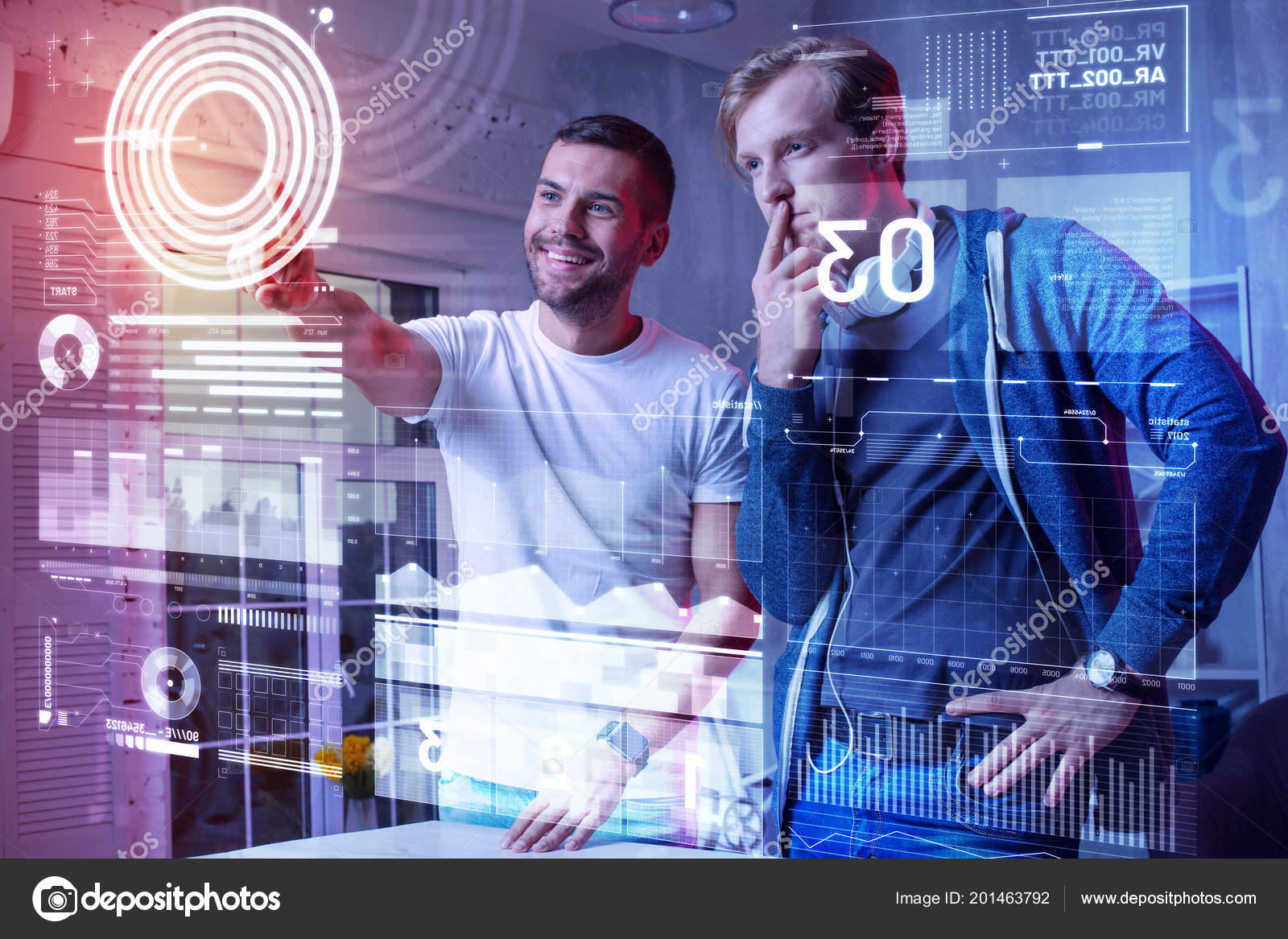 Positive IT manager smiling and his colleague looking thoughtful ...