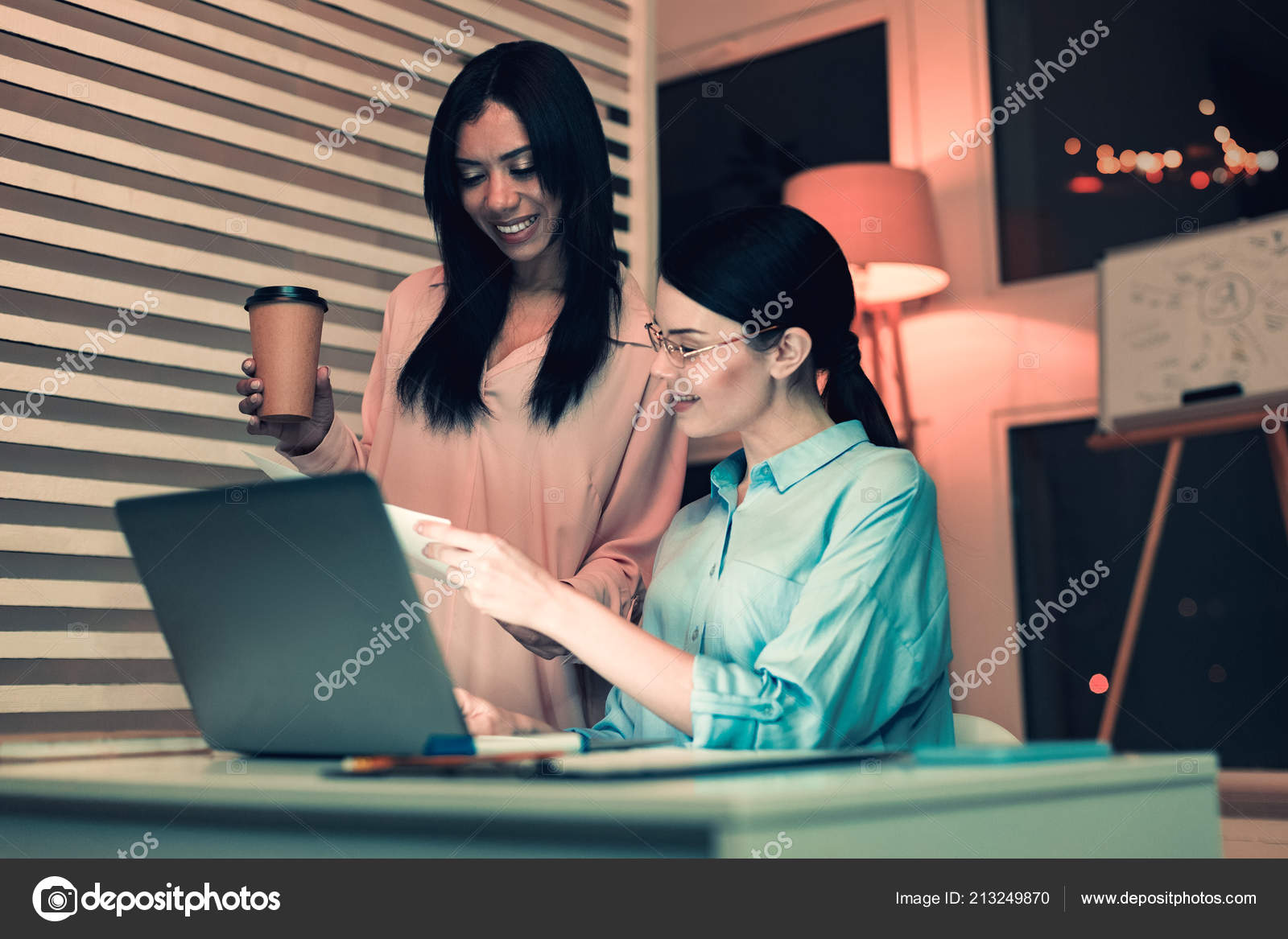 Smart woman helping her colleague Stock Photo by ©yacobchuk1 213249870