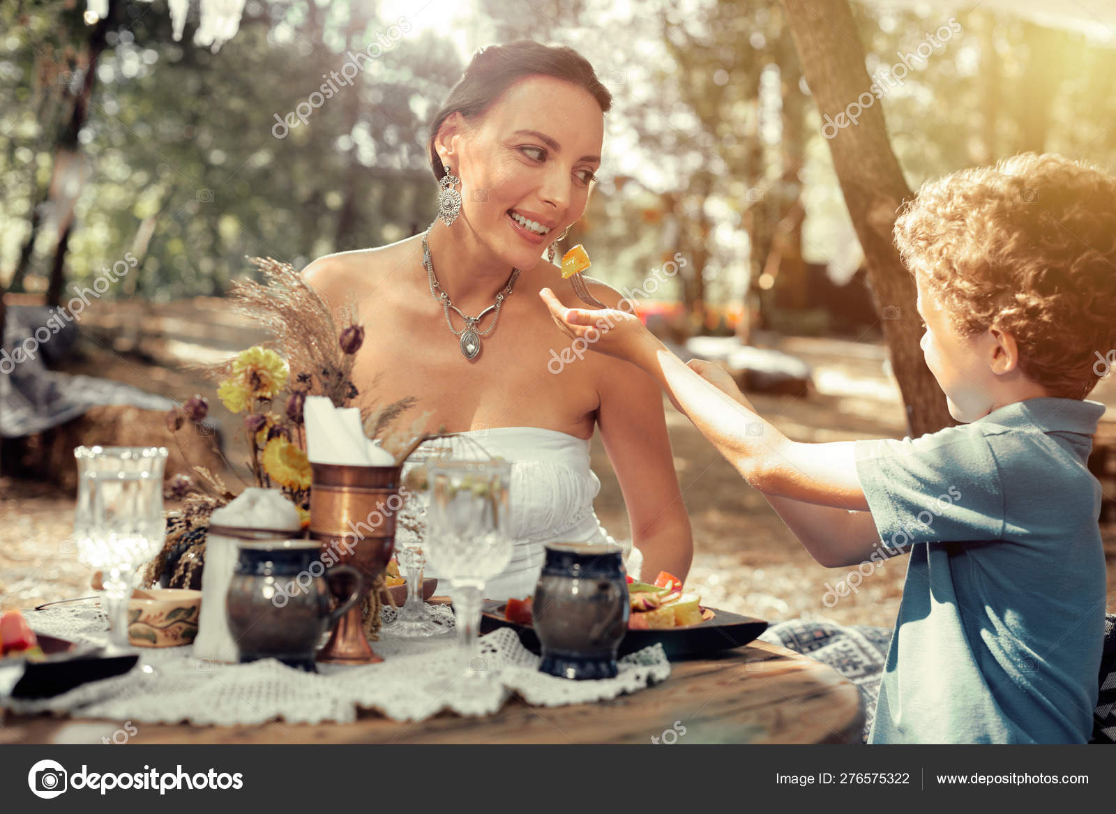 Positive cute boy caring about his mother Stock Photo by ©yacobchuk1 ...