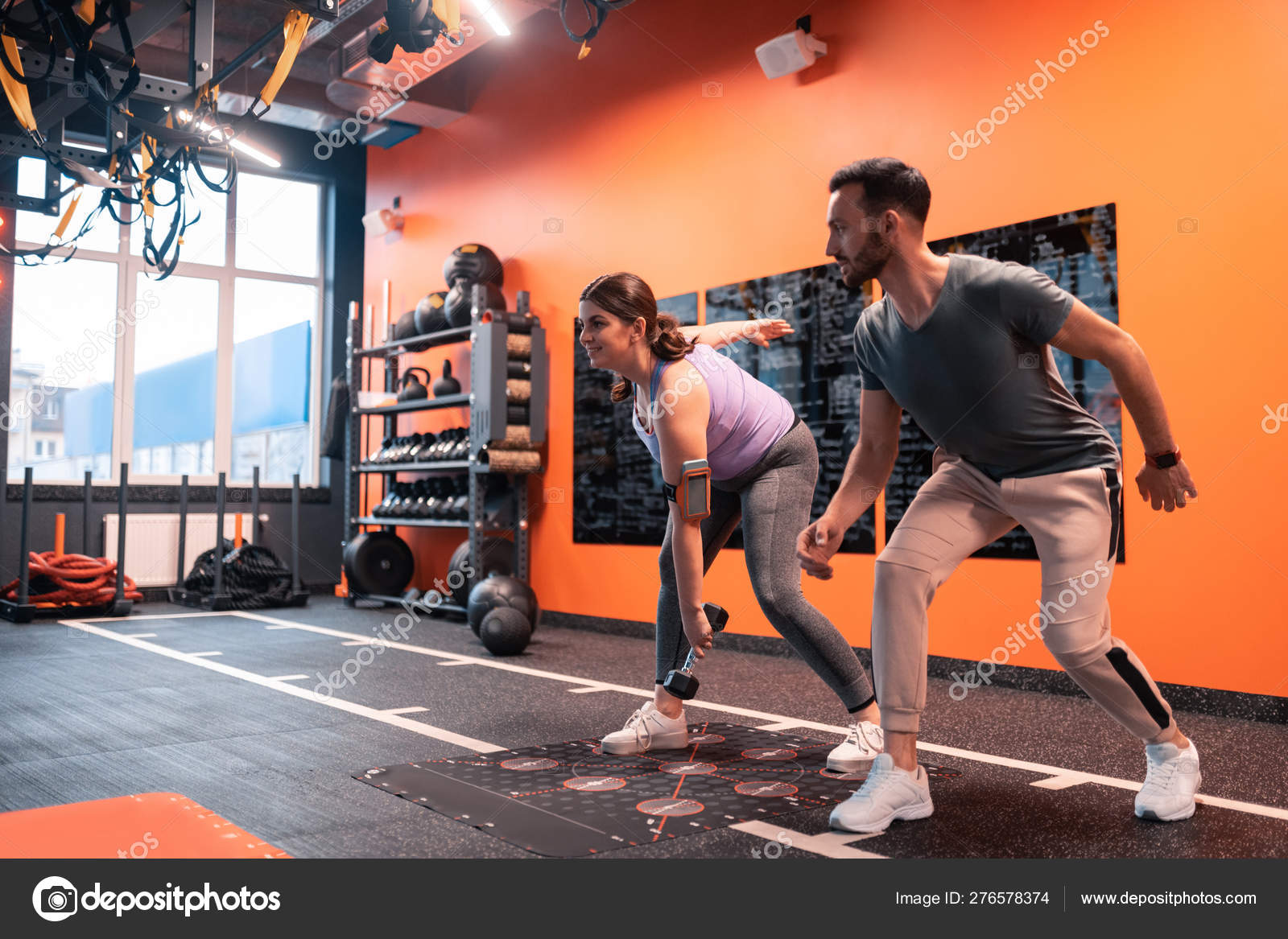 Overweight woman feeling motivated working out in gym — Stock Photo ...