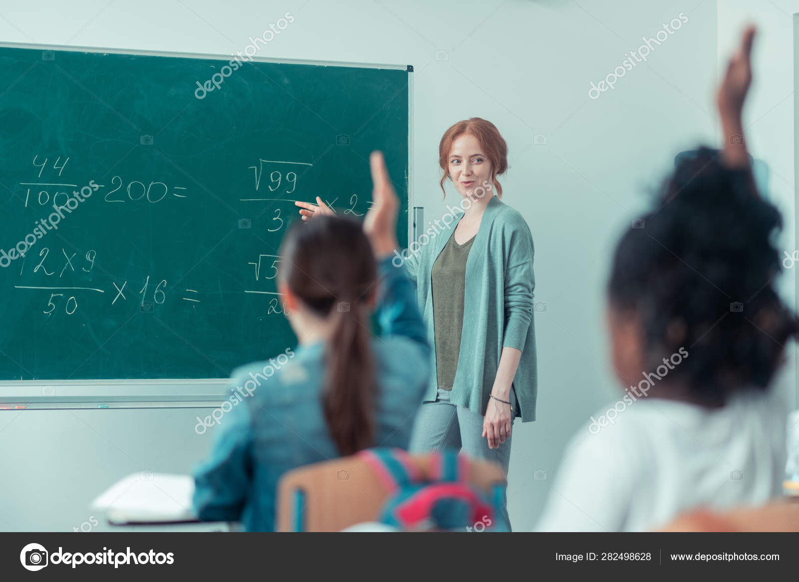 Teacher asking pupils about solution of the problem. Stock Photo by ...