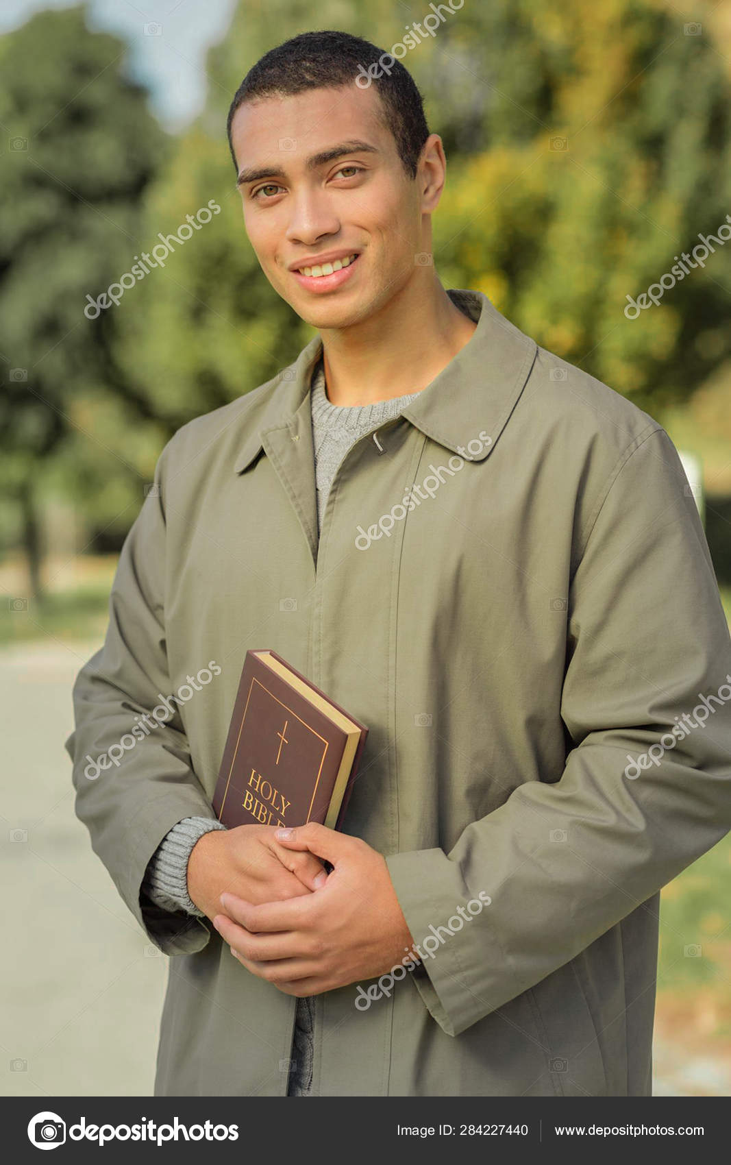 Smiling dark-haired young man being a believer — Stock Photo ...