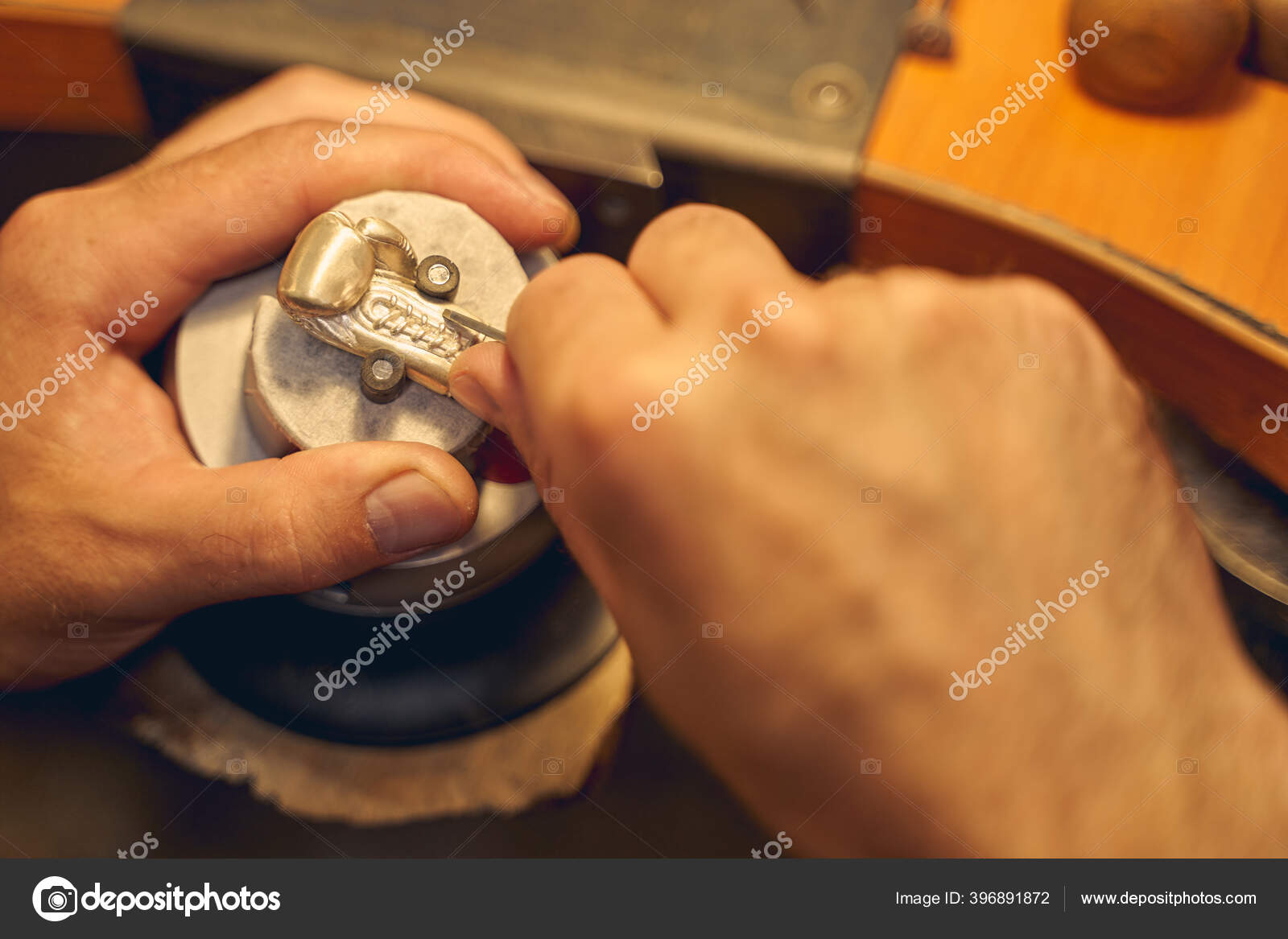 Experienced professional engraver working in a shop Stock Photo by ...