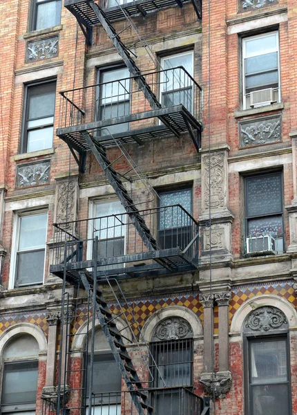 Fire escape and stairs on exterior of walk up apartment building ...