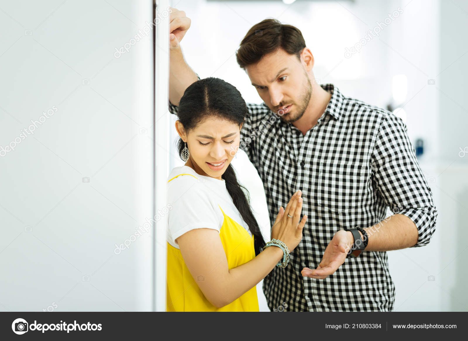 Pushy man leaning to young girl and making her feel uncomfortable ...