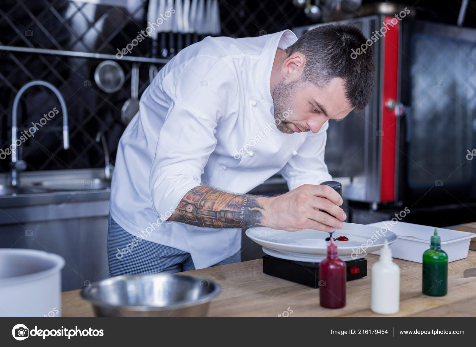 Handsome chef cooking something unusual and delicious Stock Photo by ...