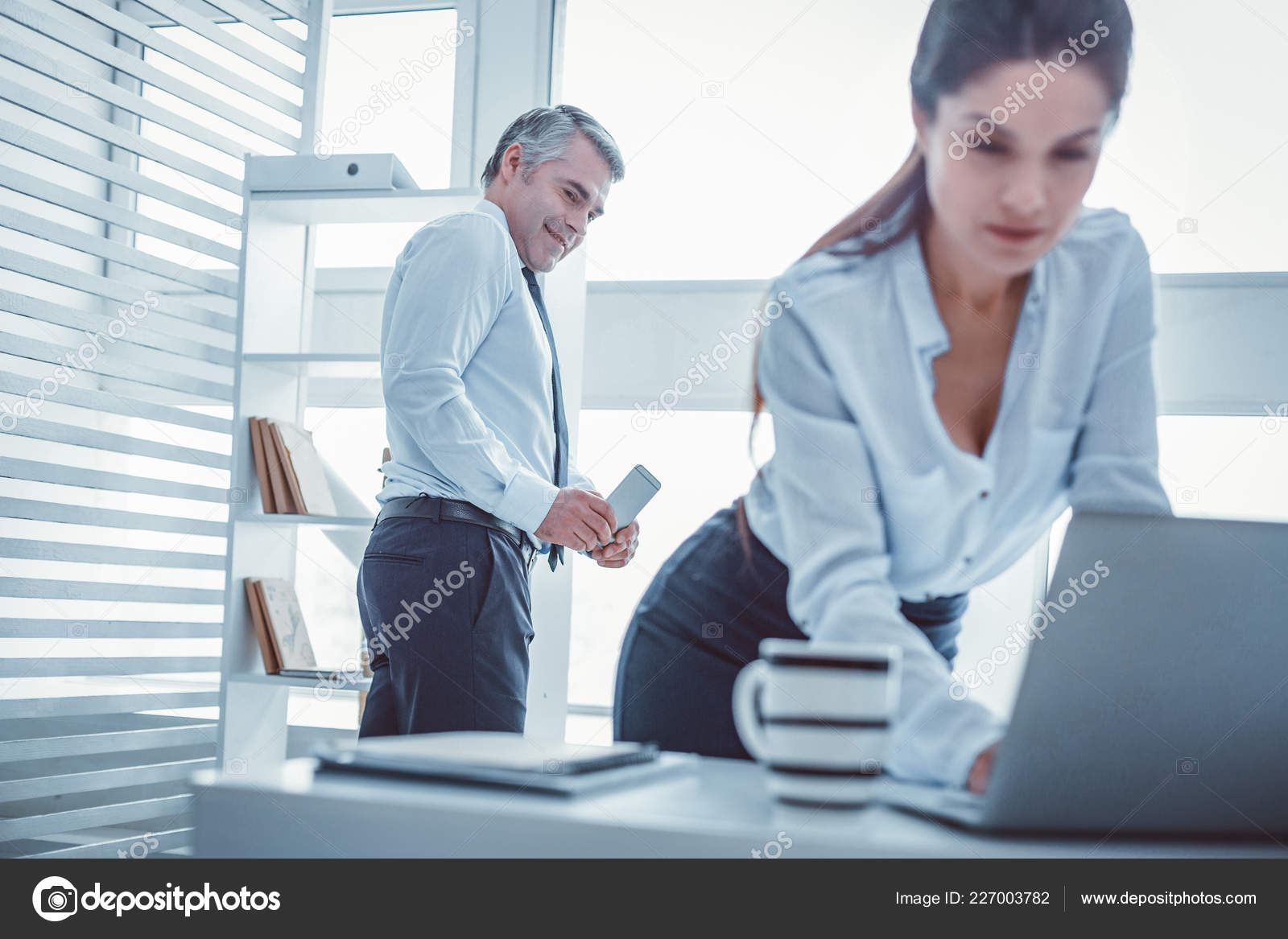 Smiling handsome superior photographing charming fit employee — Stock ...