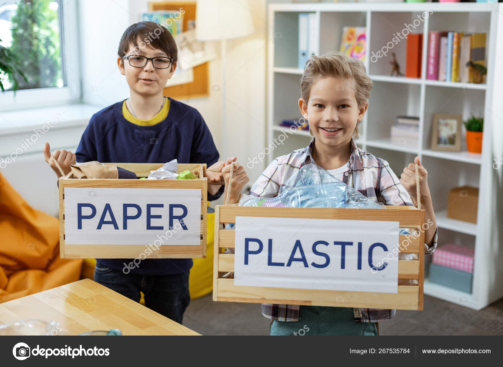 Proud resolute pupils presenting result of their work Stock Photo by ...