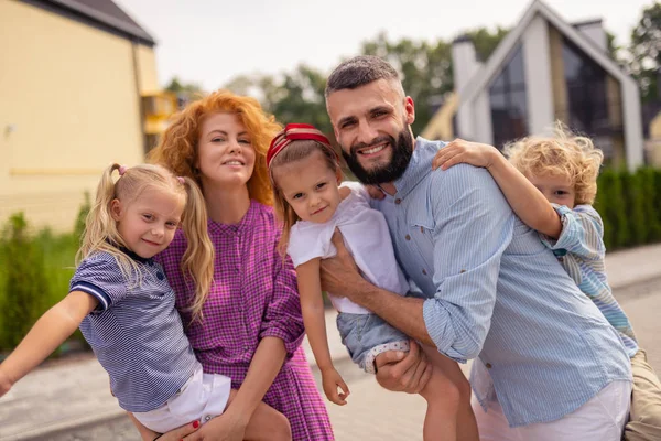 Nice positive happy family looking at you - Stock Image - Everypixel