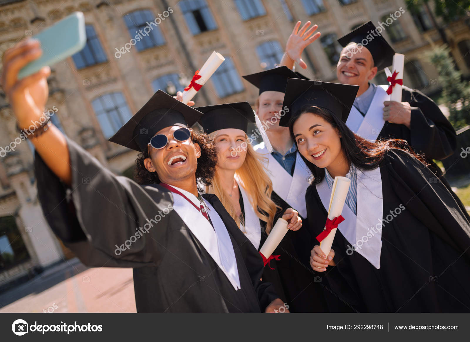 Happy graduates taking a selfie together near university. — Stock Photo ...