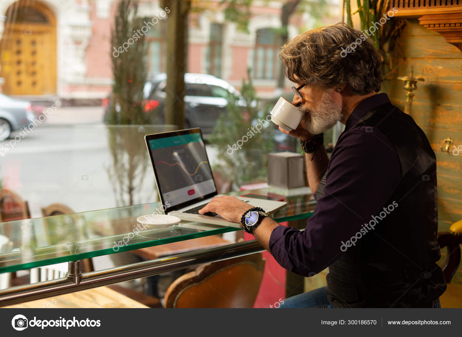 Handsome man enjoying his coffee and working. Stock Photo by ©Dmyrto_Z ...