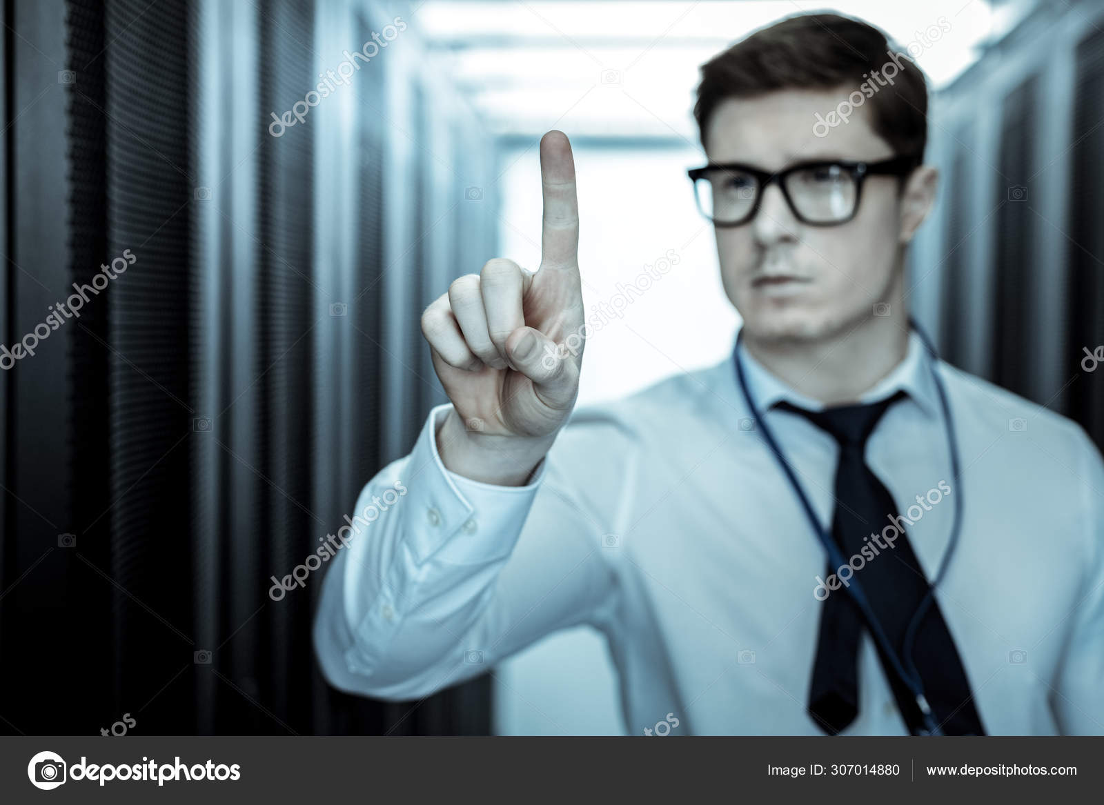 Short-haired security guard in a blue shirt looking attentive Stock ...