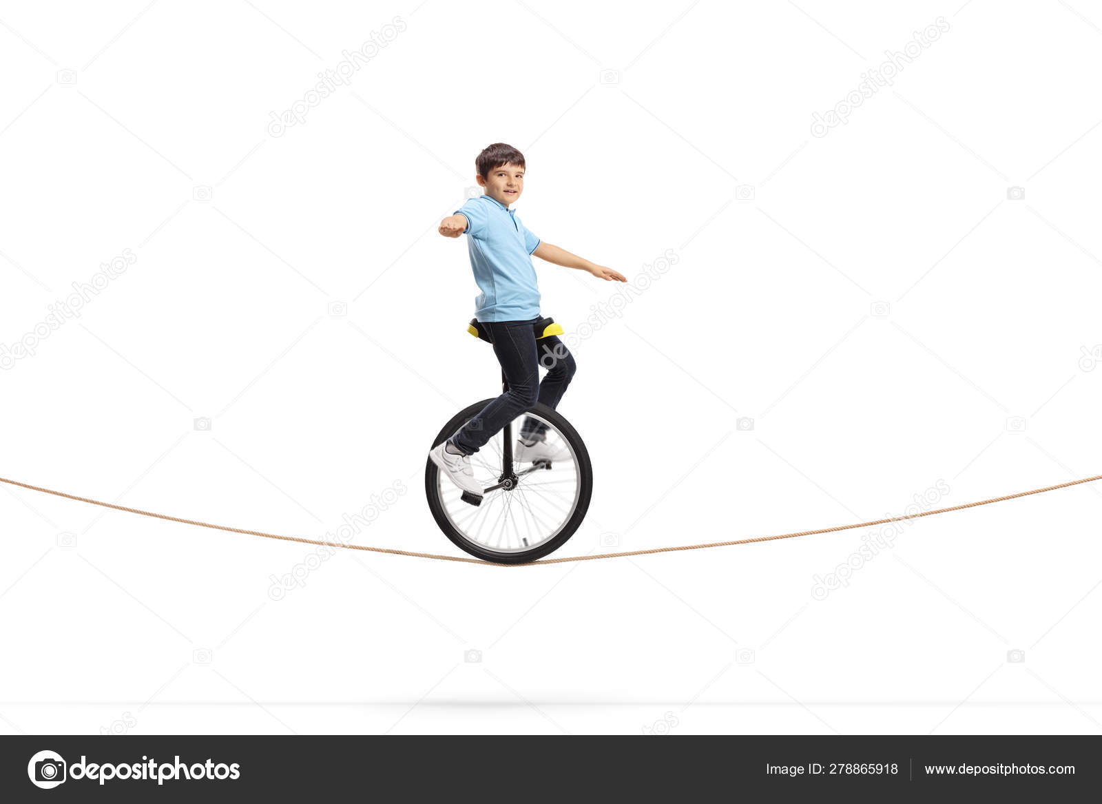Boy riding a unicycle on a rope Stock Photo by ©ljsphotography 278865918