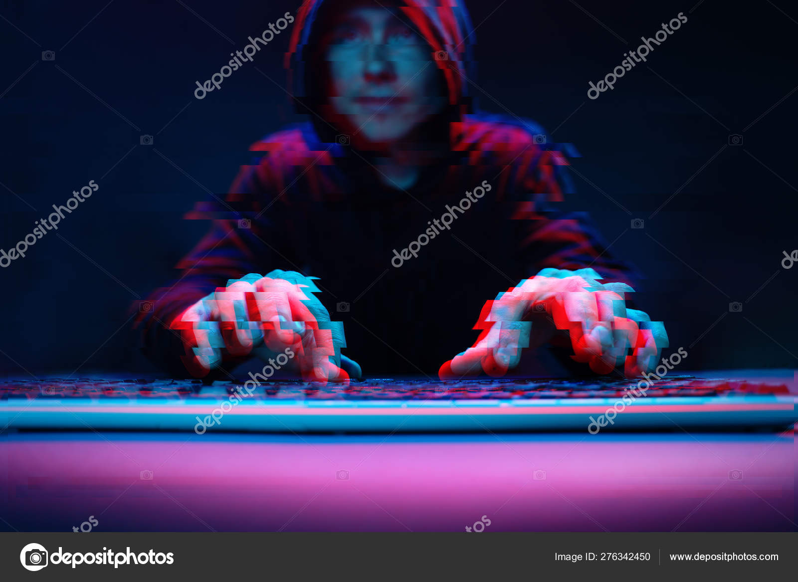 Hacker In The Hood Working With Computer Typing Text In Dark Room Image With Glitch Effect