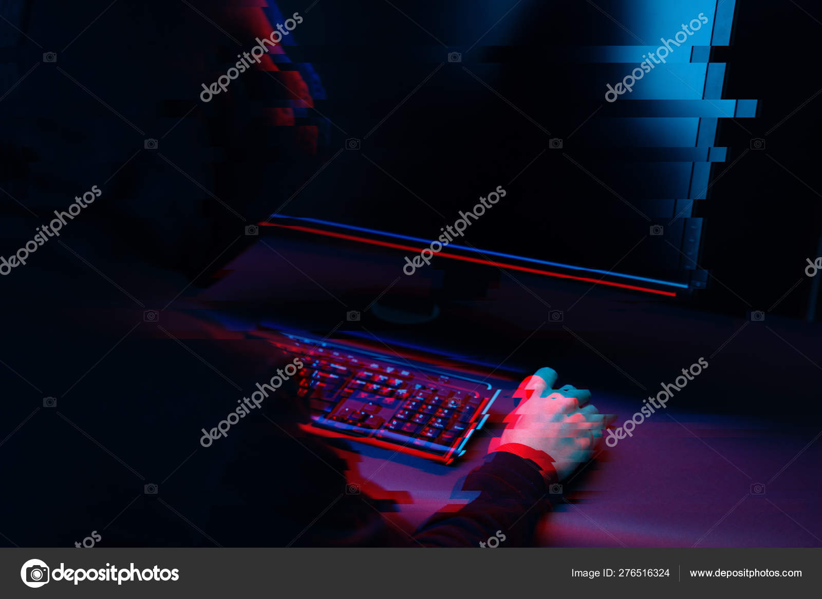 Hacker In The Hood Working With Computer Typing Text In Dark Room Image With Glitch Effect
