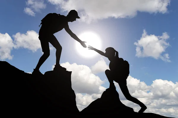 Two People Helping Each Other